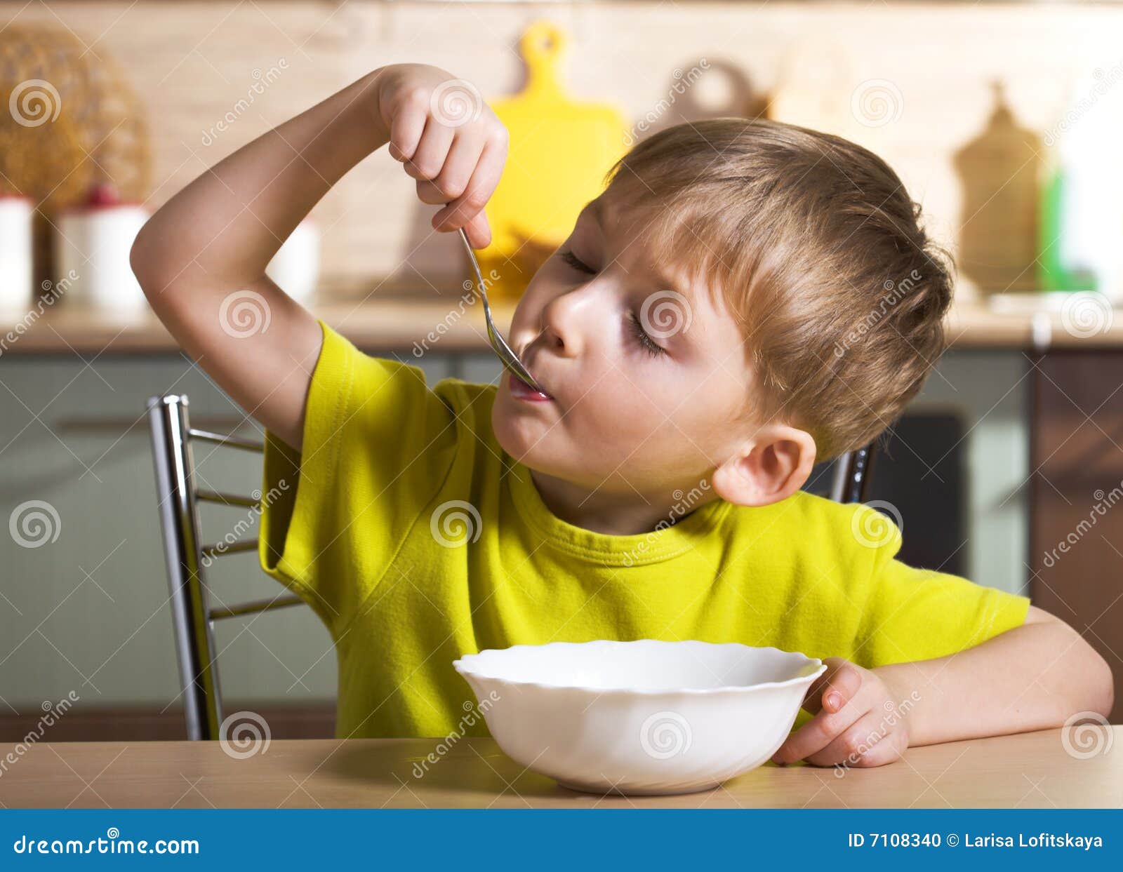 Child eating breakfast stock photo. Image of morning, young - 7108340