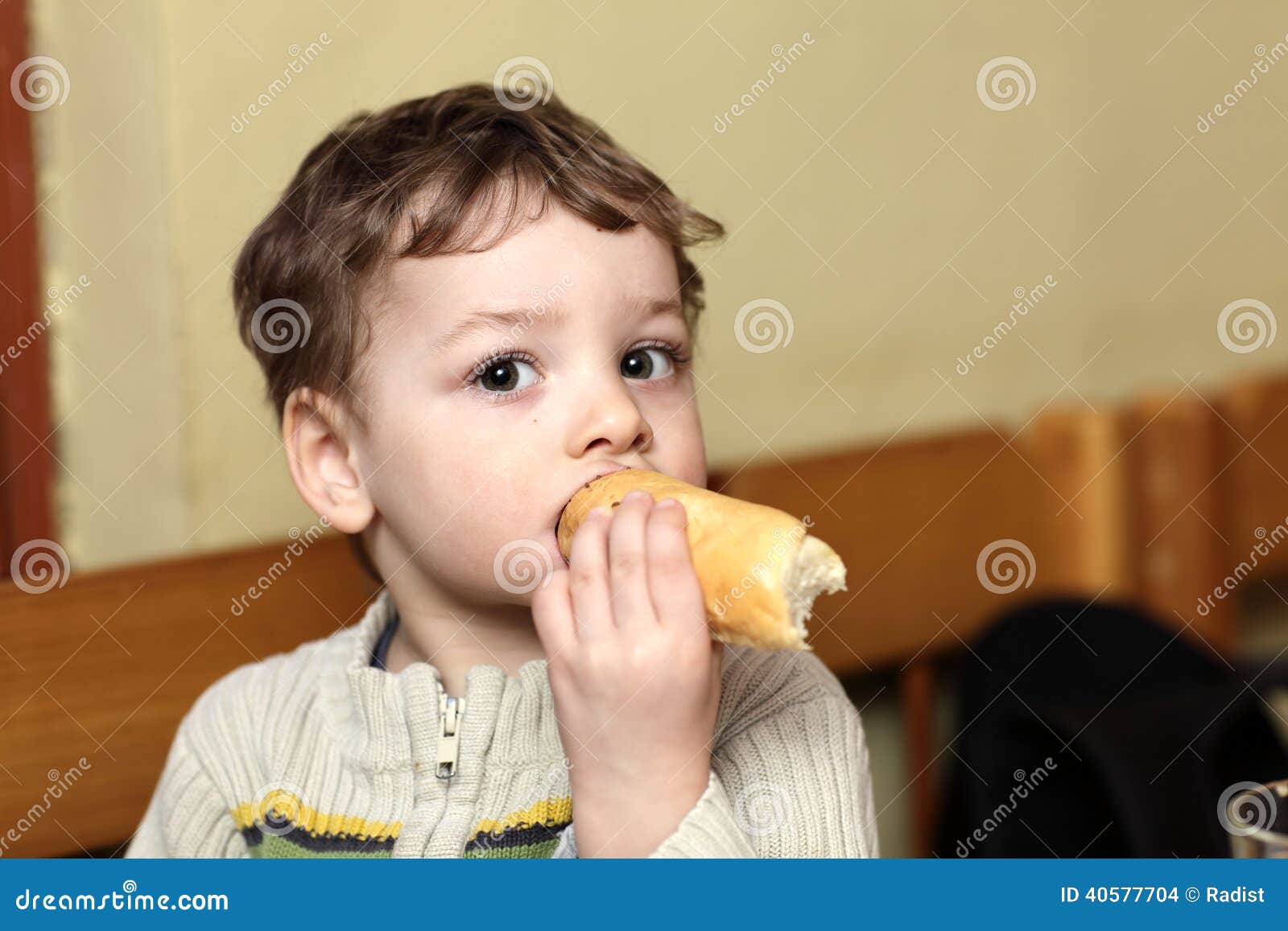 Child eating bun stock photo. Image of lunch, lifestyle - 40577704