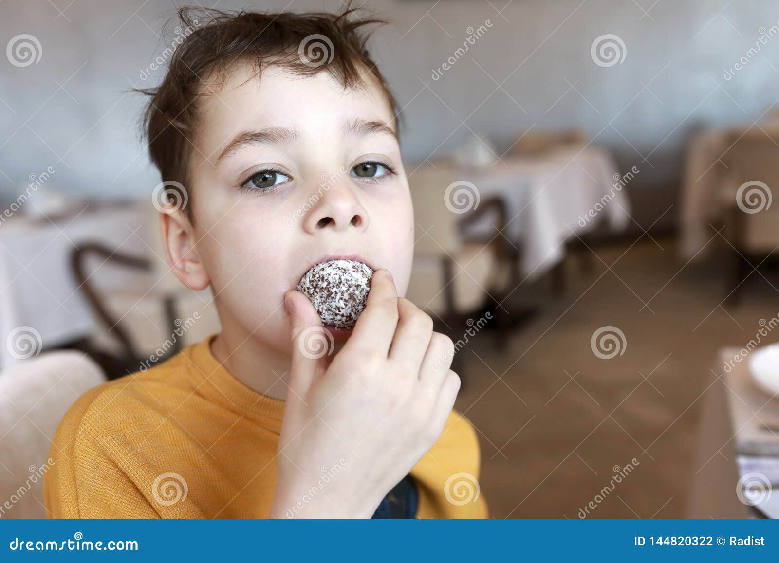 Child eating cake stock photo. Image of indoor, lunch - 144820322