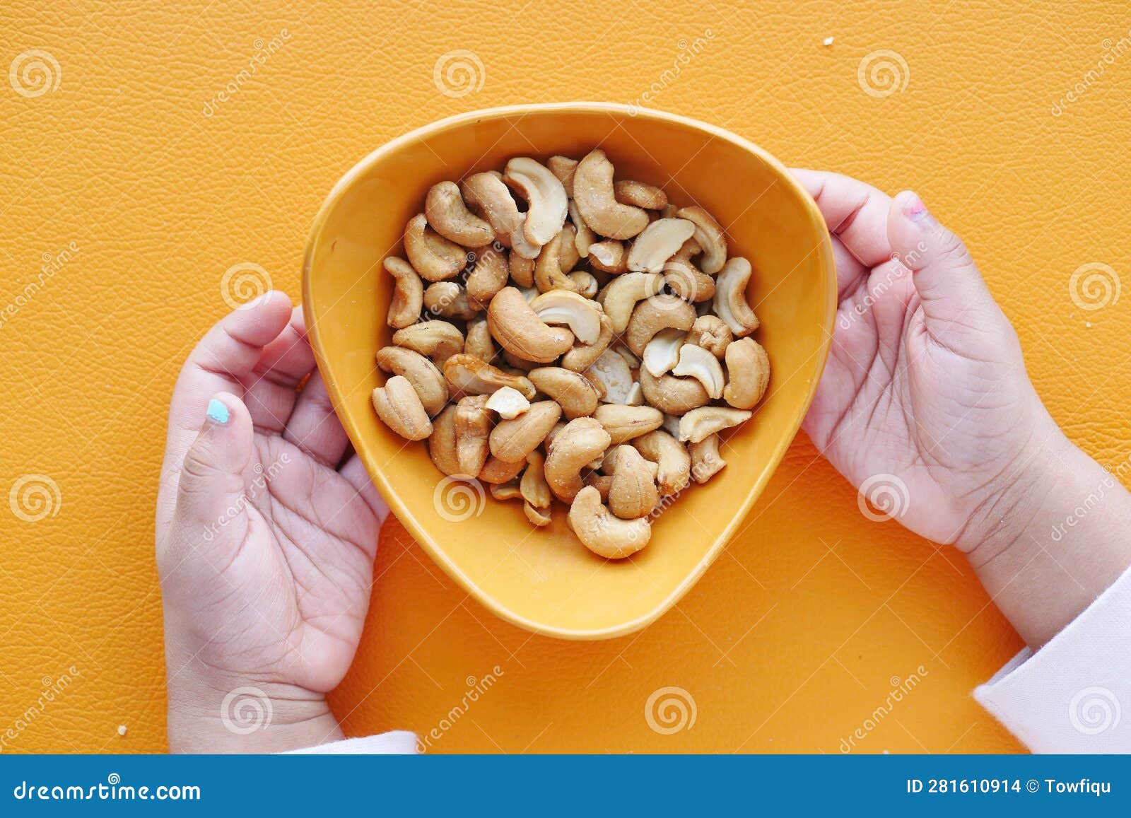 Child Eating Cashew Nuts on Table Stock Photo - Image of heap ...