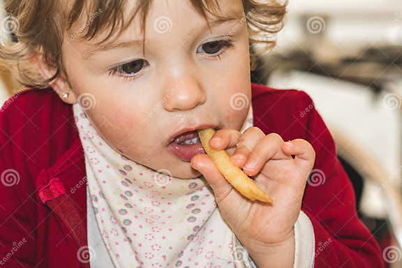 Child eating chips stock image. Image of expression - 117317431