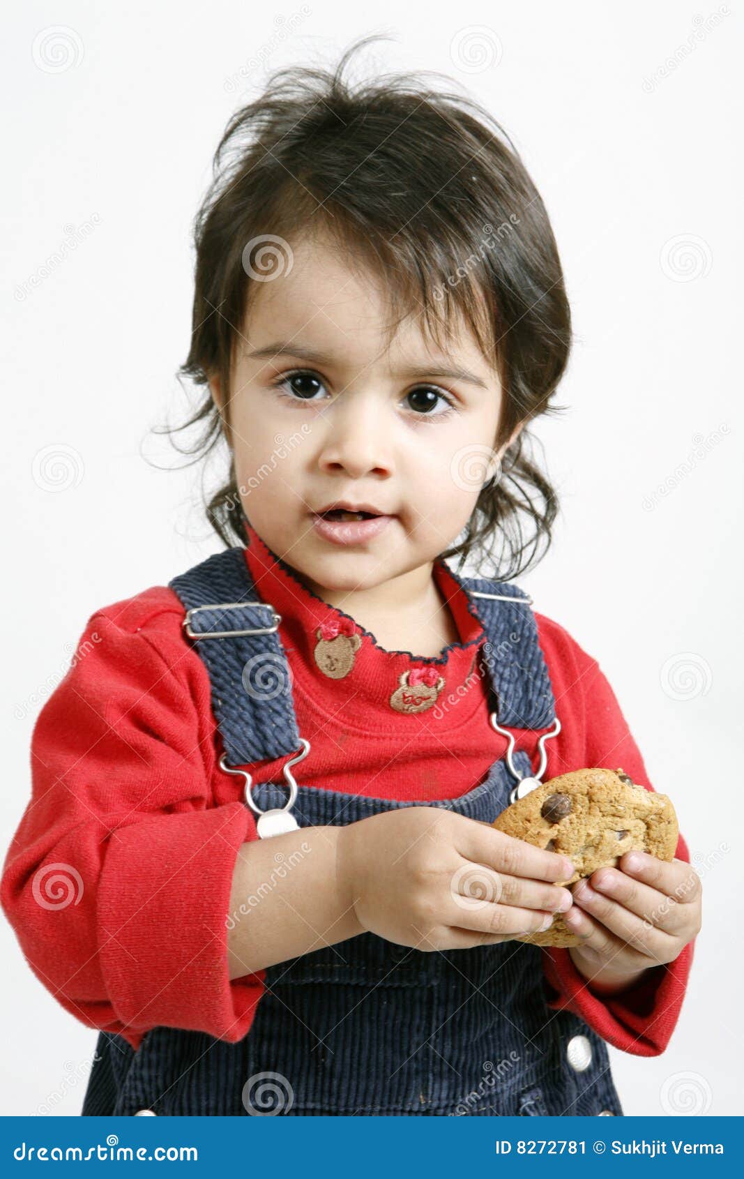 Child eating cookie stock image. Image of girl, elementary - 8272781