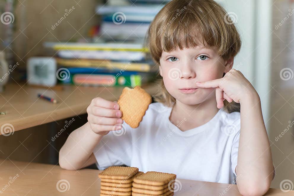 Child eating cookies stock photo. Image of shoulders - 80373148
