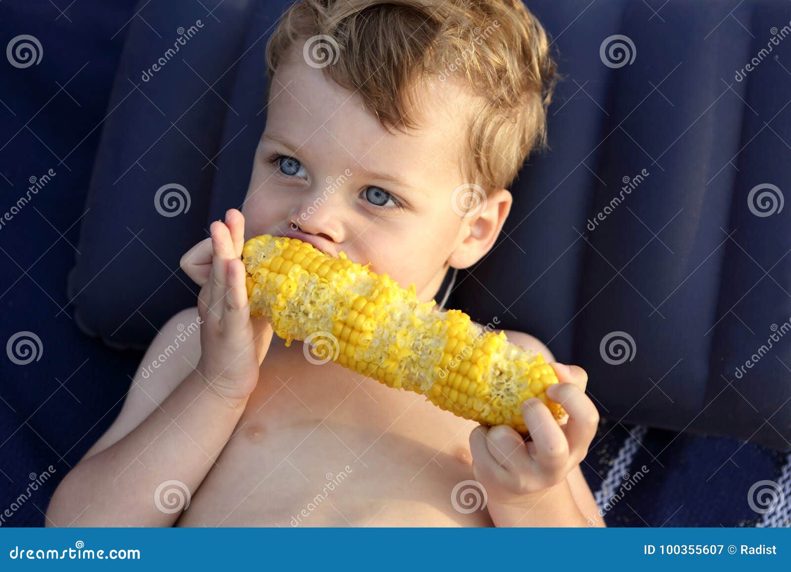 Child eating corn stock image. Image of lifestyle, picnic - 100355607