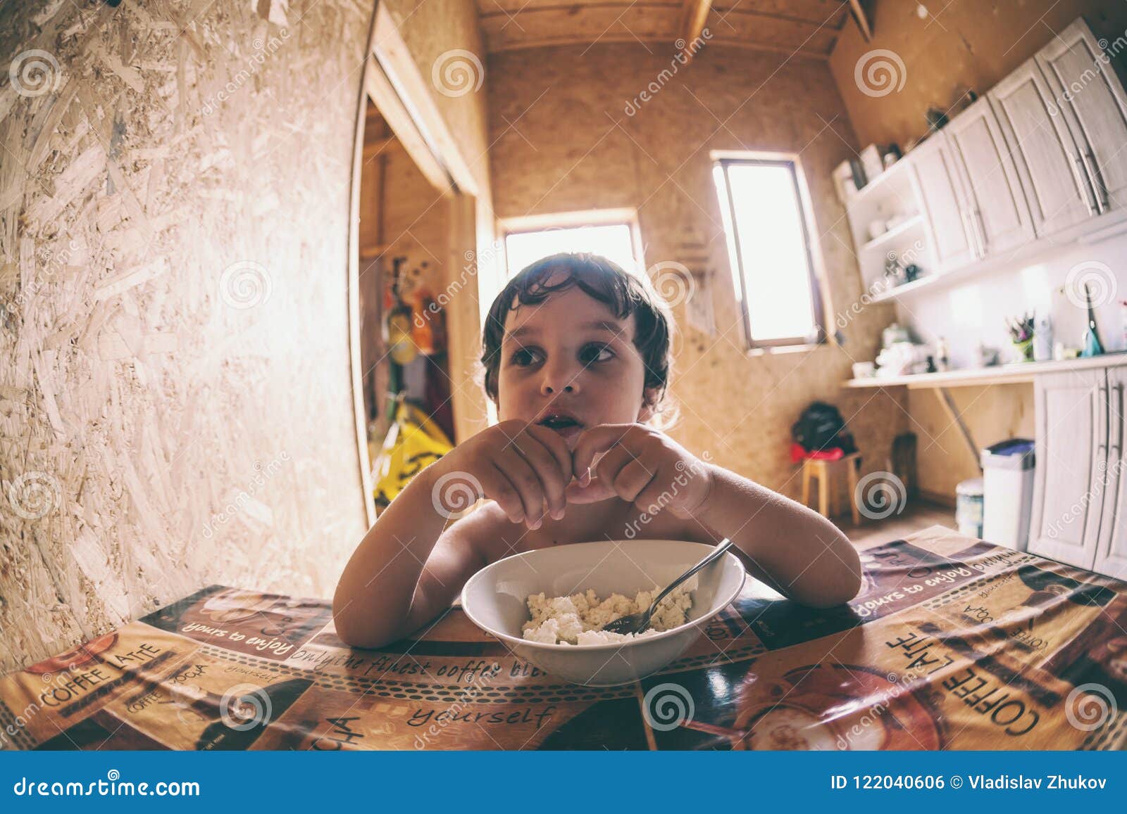 The Child is Eating Cottage Cheese Stock Photo - Image of child, hungry ...