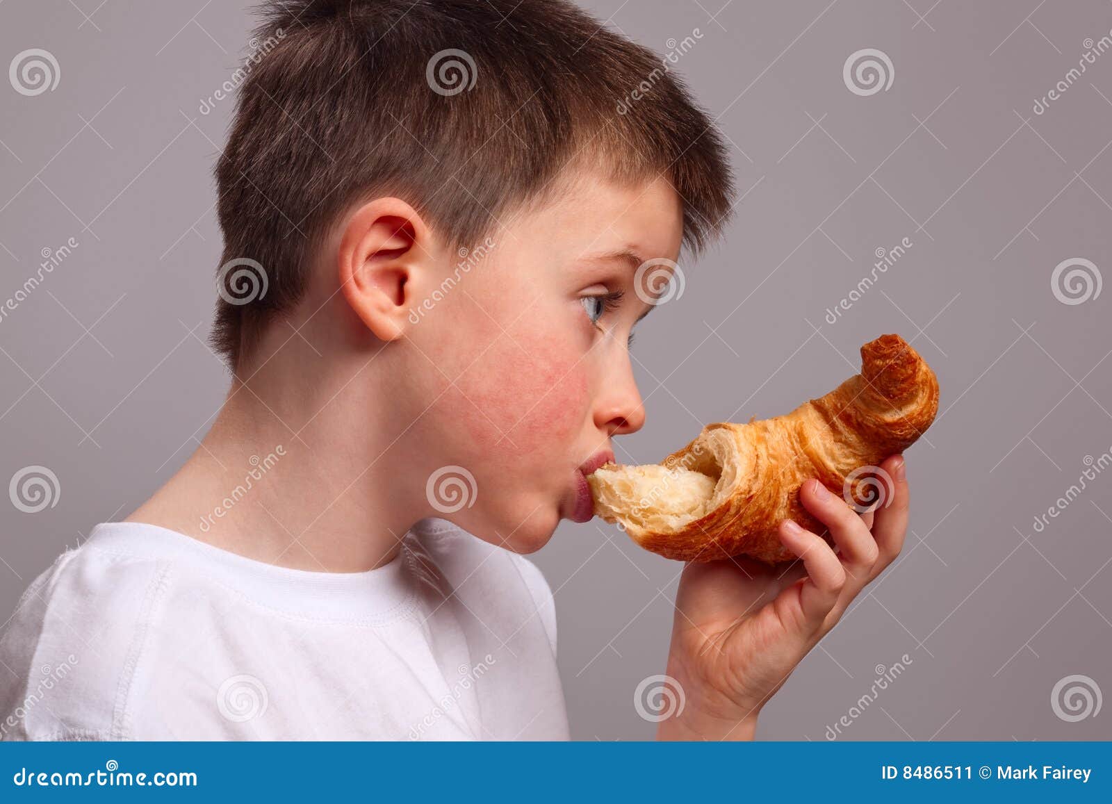 Child eating a croissant stock image. Image of head, boys - 8486511