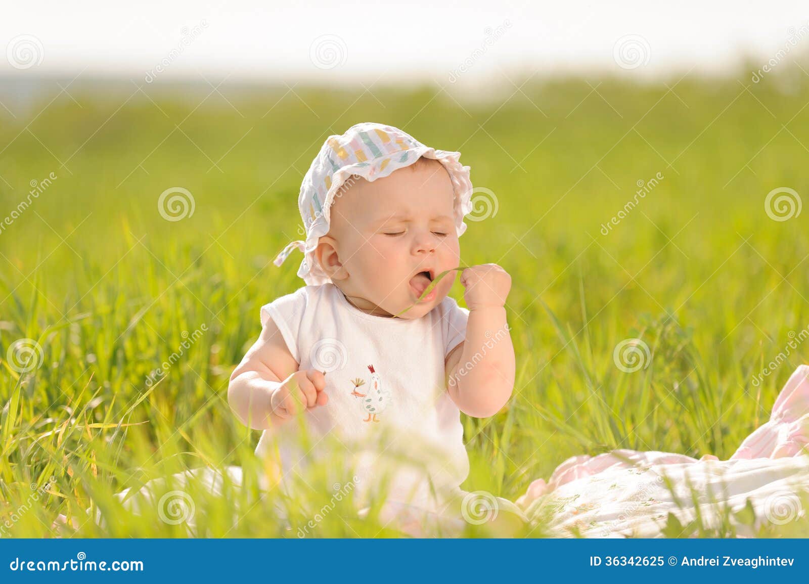 Child Eating Grass stock image. Image of holding, hand - 36342625
