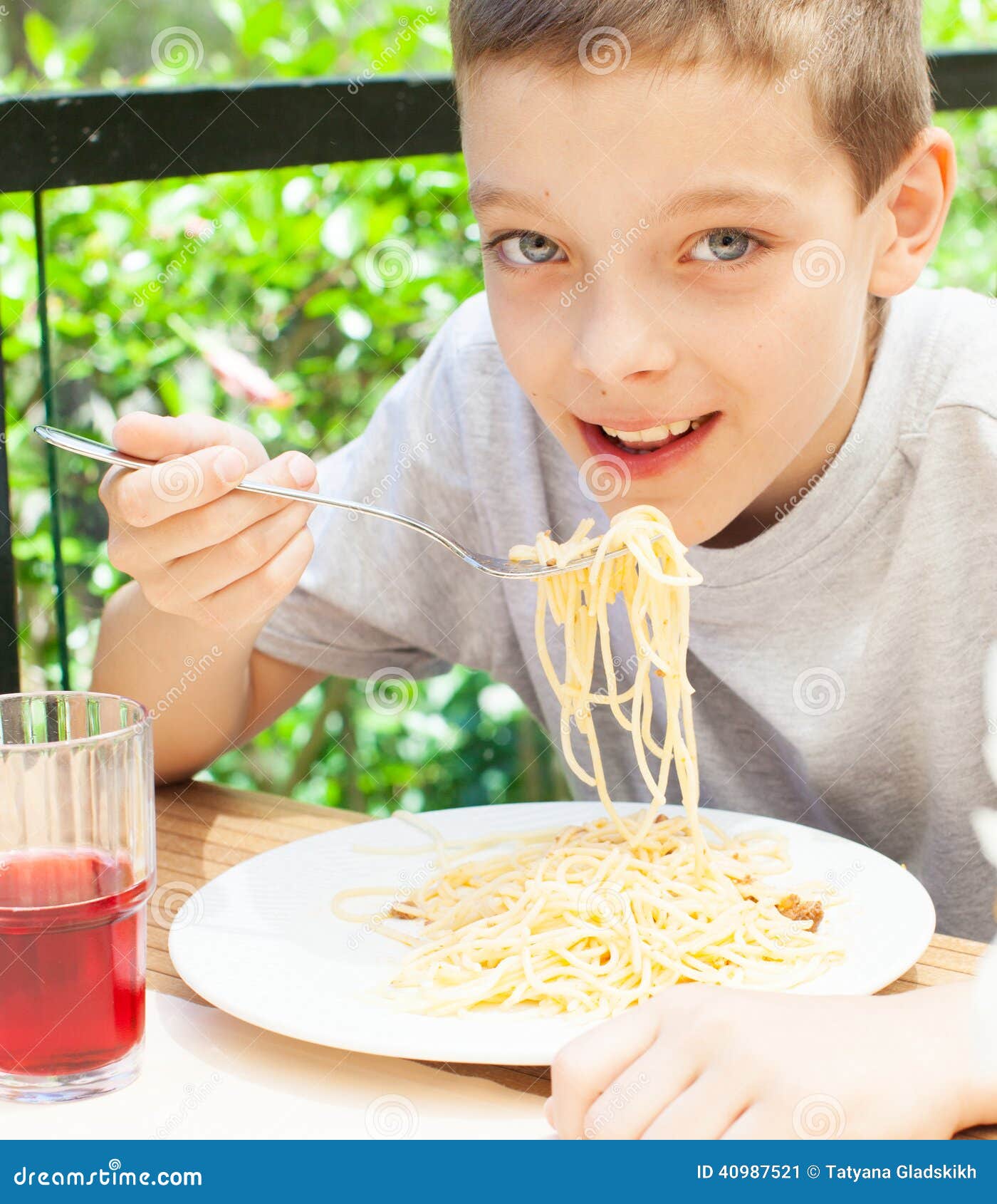 Child Eating Pasta Outdoors Stock Image - Image of eating, healthy ...