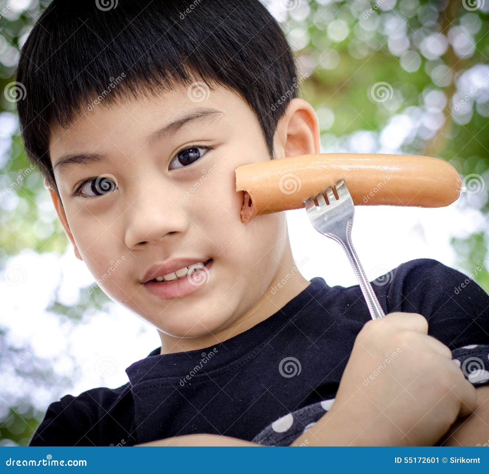 Child eating a sausage stock image. Image of nutrition - 55172601