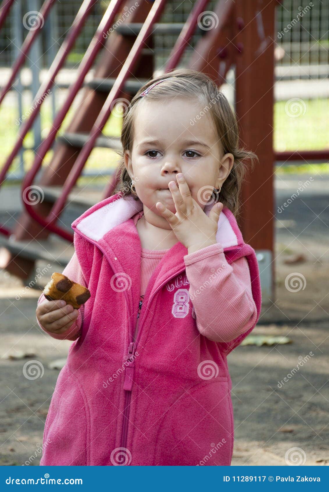 Child eating snack stock image. Image of ground, small - 11289117