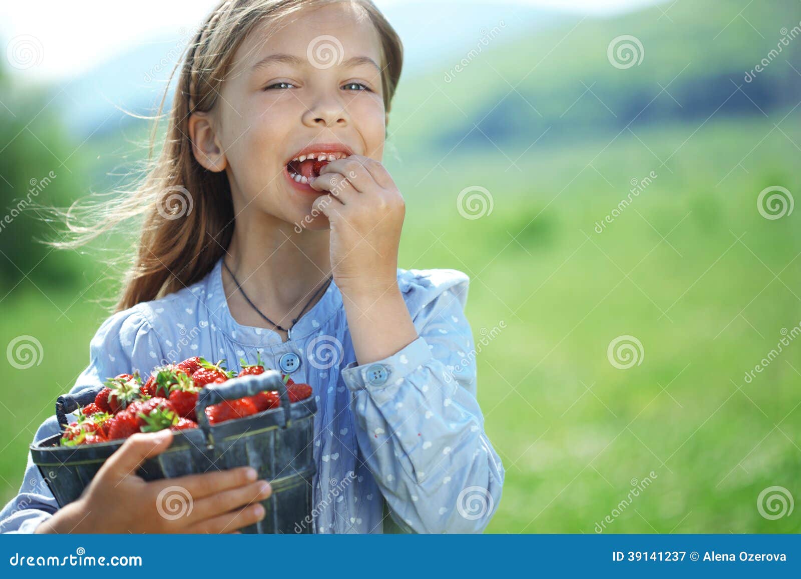 Child Eating Strawberries in a Field Stock Image - Image of joyful ...