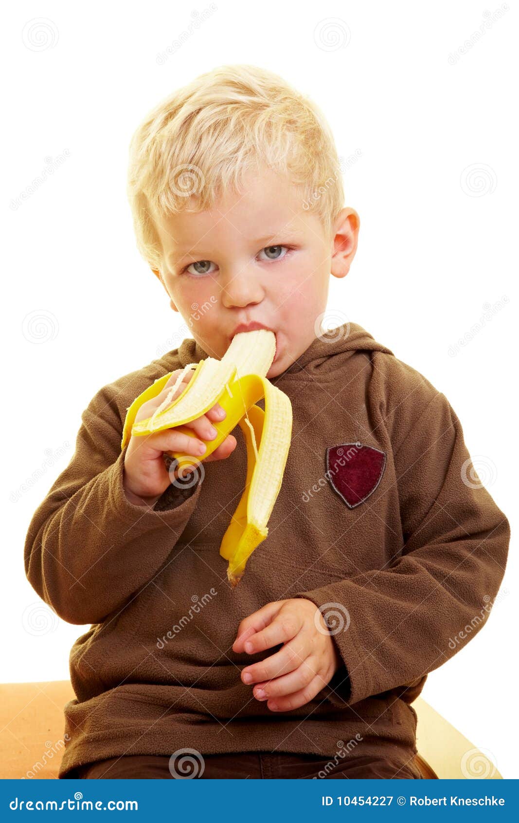 Child eats banana stock image. Image of infant, bite - 10454227