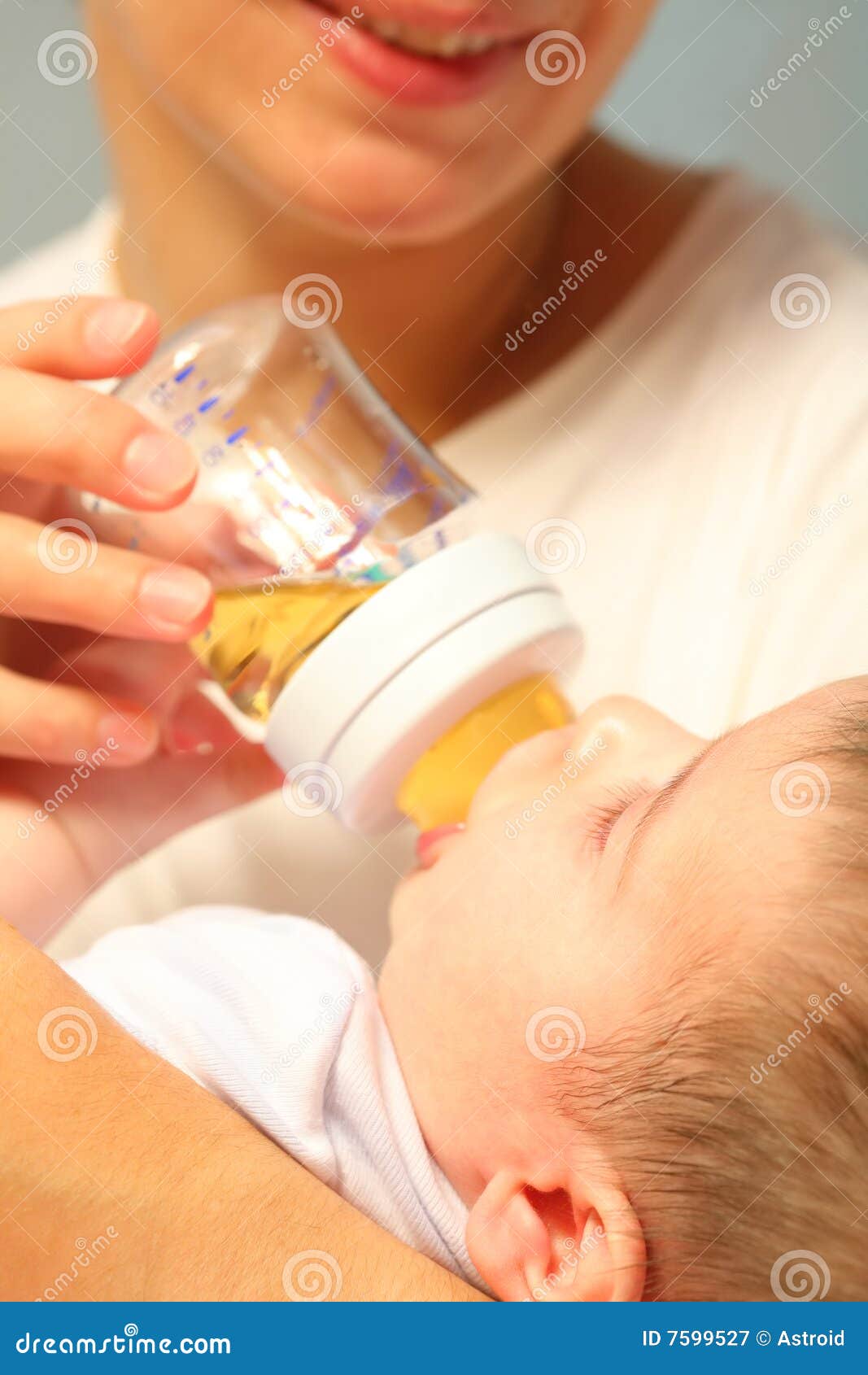 Child eats from bottle stock image. Image of baby, bottle - 7599527