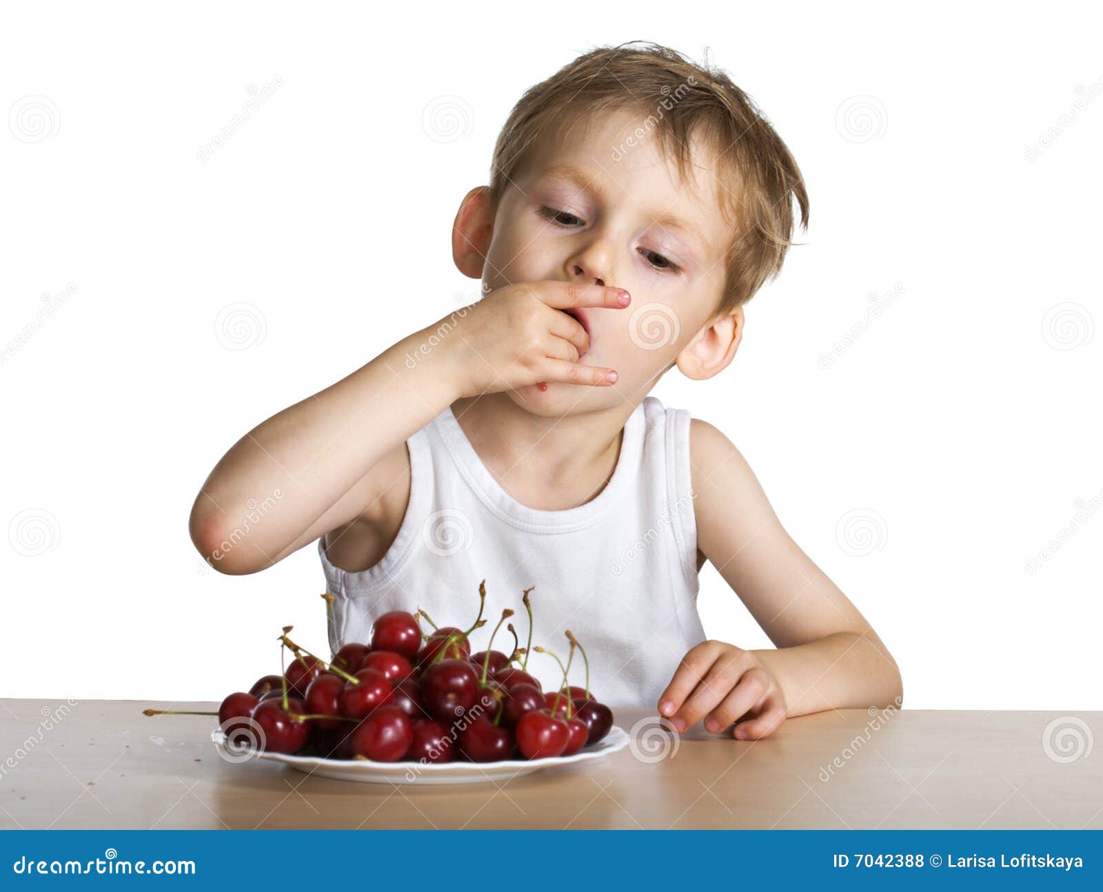 Child eats a cherry stock photo. Image of juicy, vitamins - 7042388