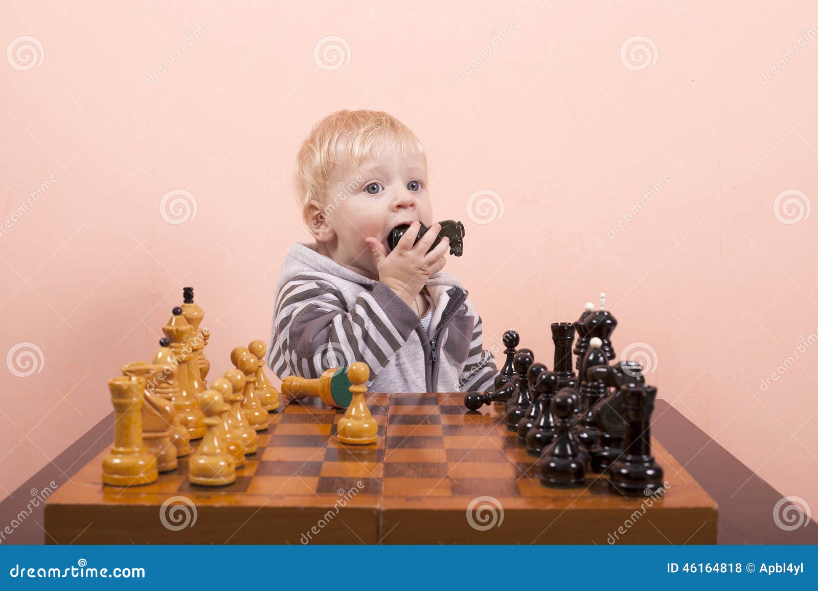 The child eats chess stock photo. Image of creativity - 46164818