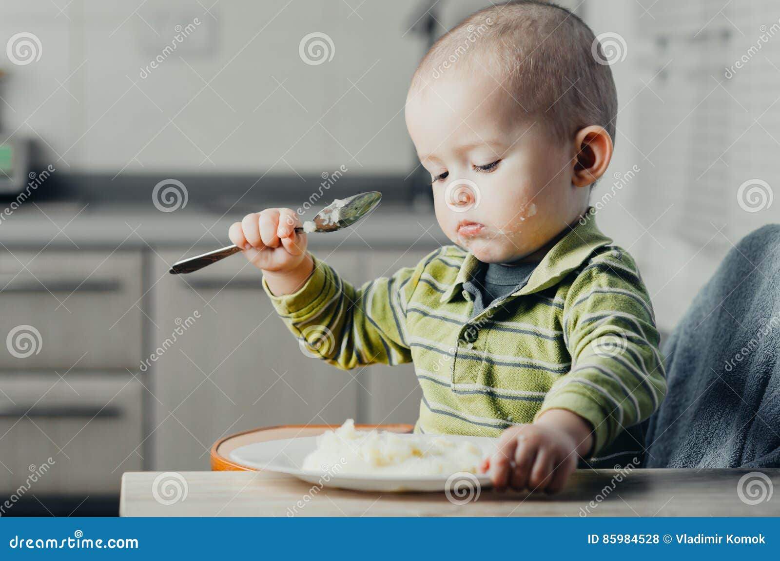 The Child Eats Mashed Potatoes Stock Photo - Image of independent ...