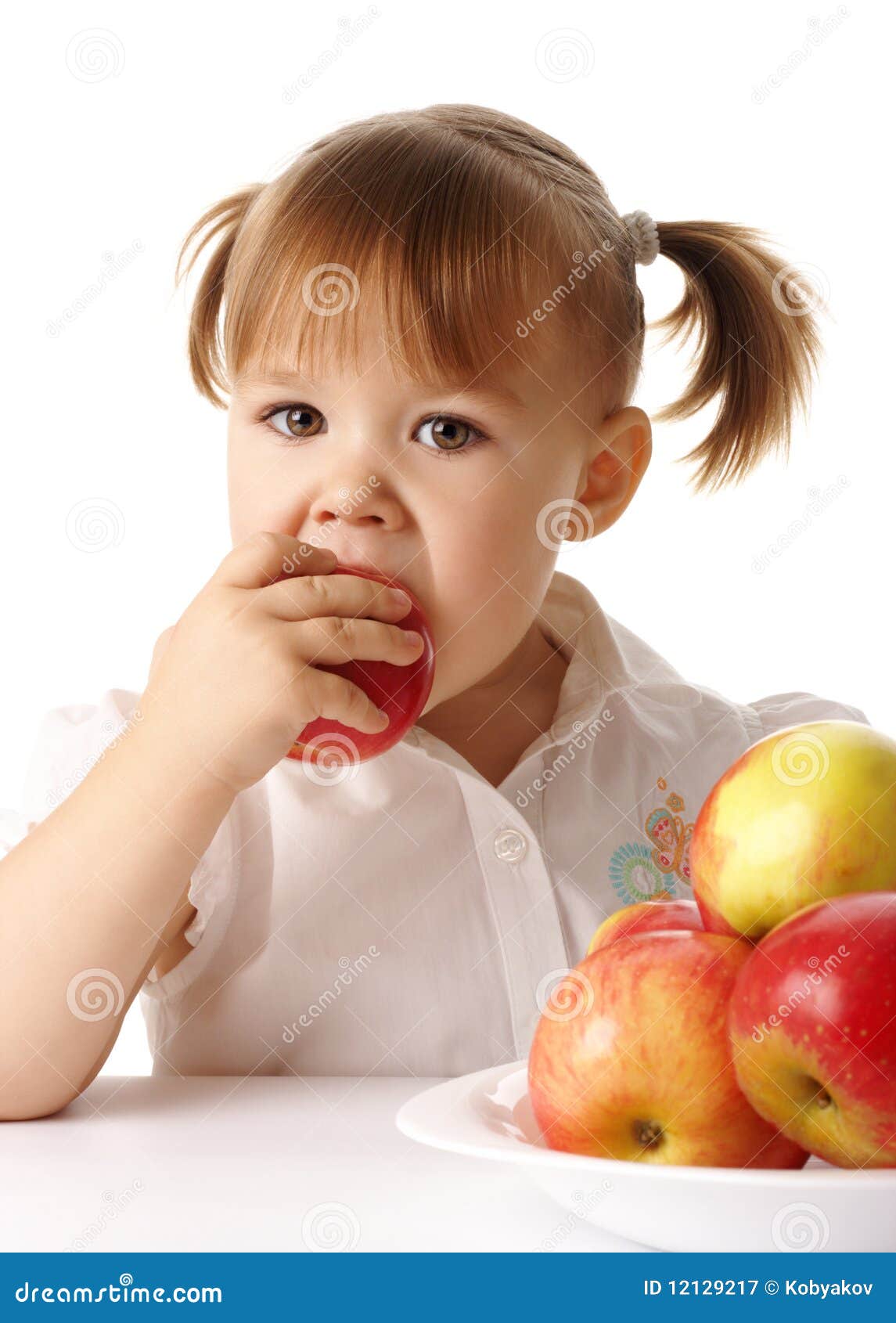 Child eats red apple stock image. Image of girl, close - 12129217