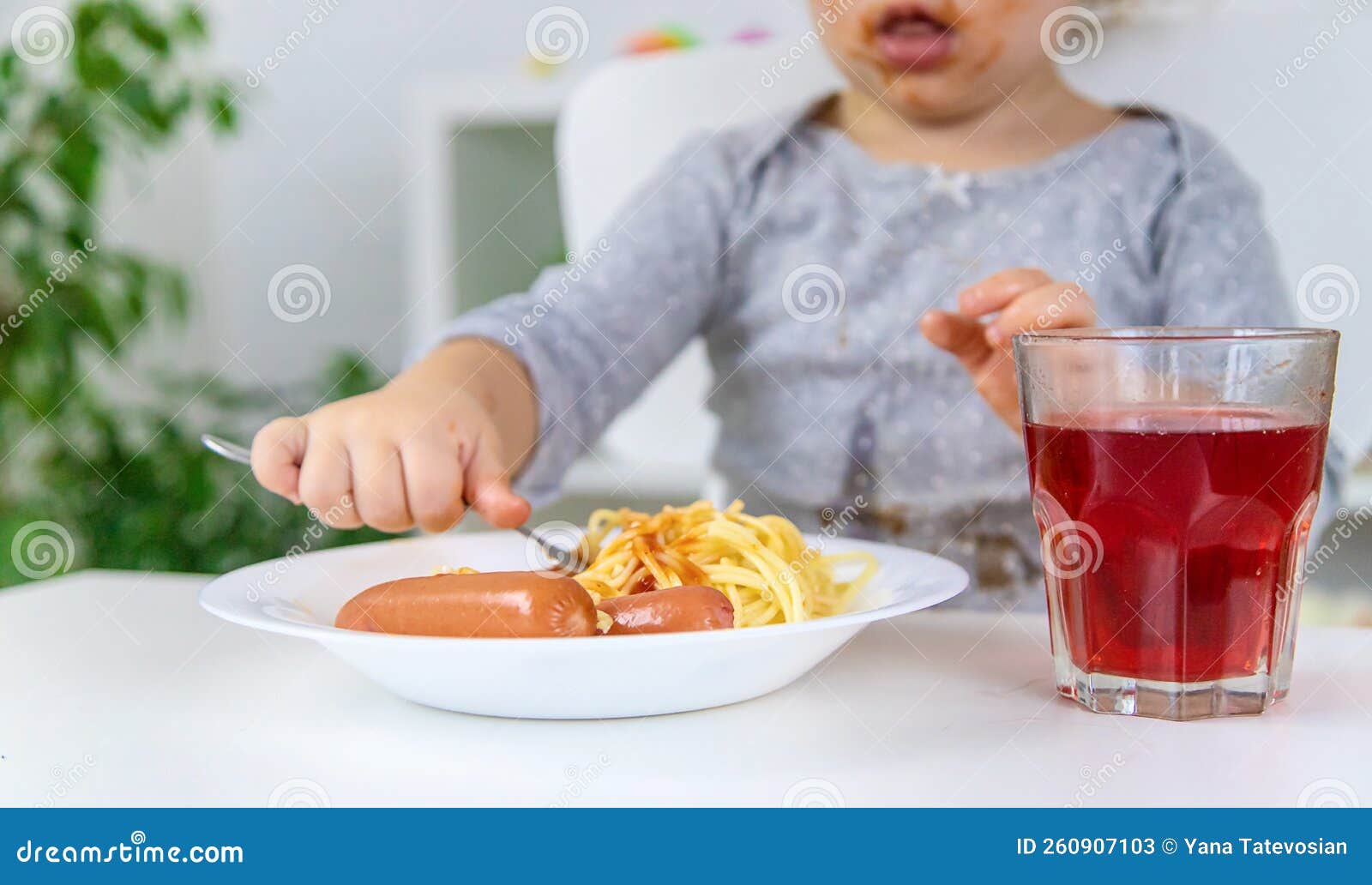 The Child Eats Spaghetti Lunch. Selective Focus Stock Image - Image of ...