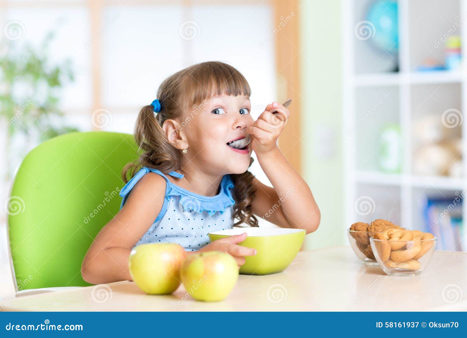 Child eats tasty breakfast stock image. Image of meal - 58161937