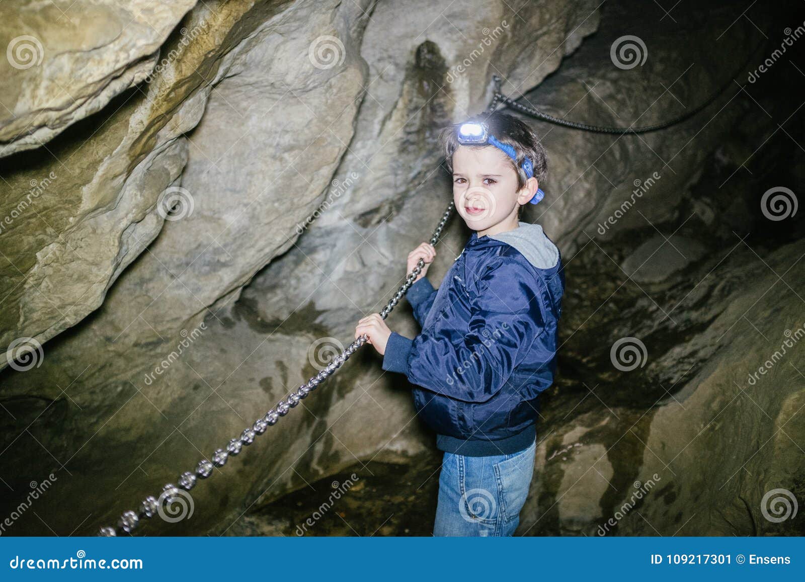 Children Explore Underground Cavern Stock Image - Image of earth ...