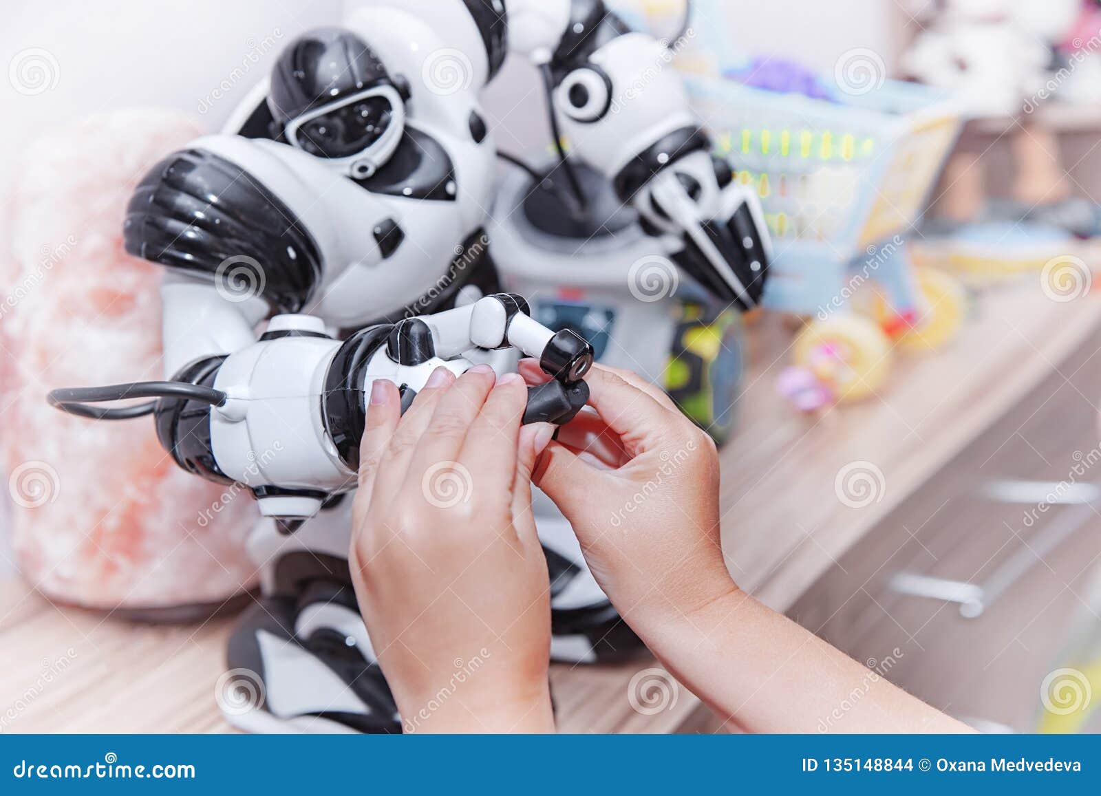 The Child Extends A Hand To The Robot. The Concept Of Friendship ...
