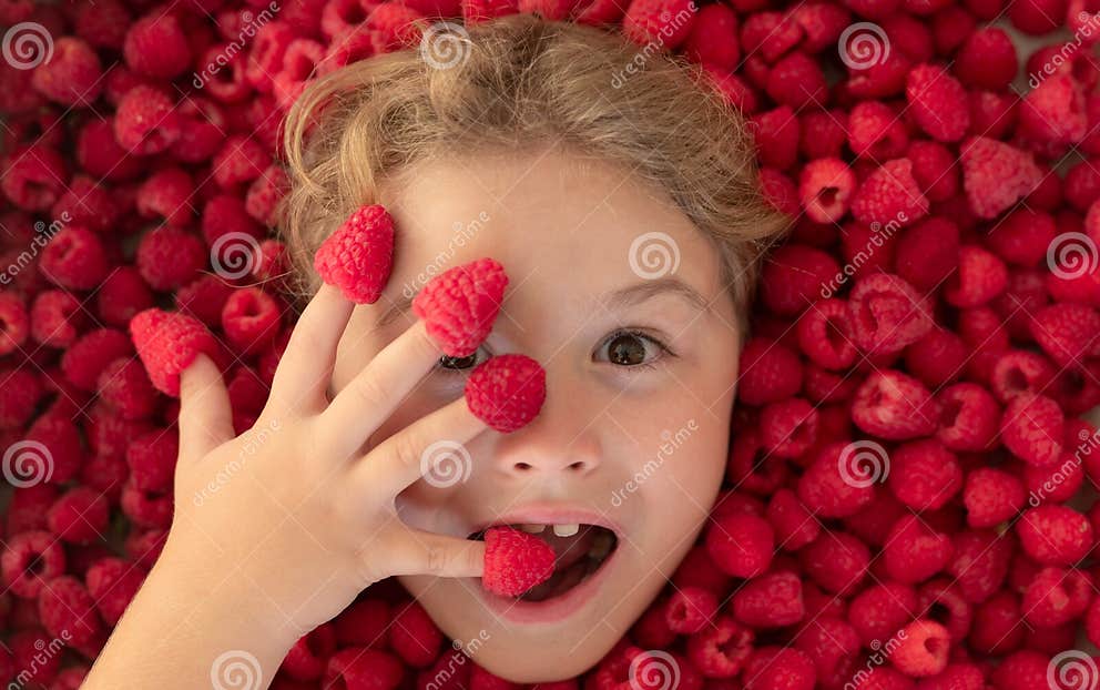 Child Face with Raspberry Frame, Close Up Raspberry Background. Stock ...