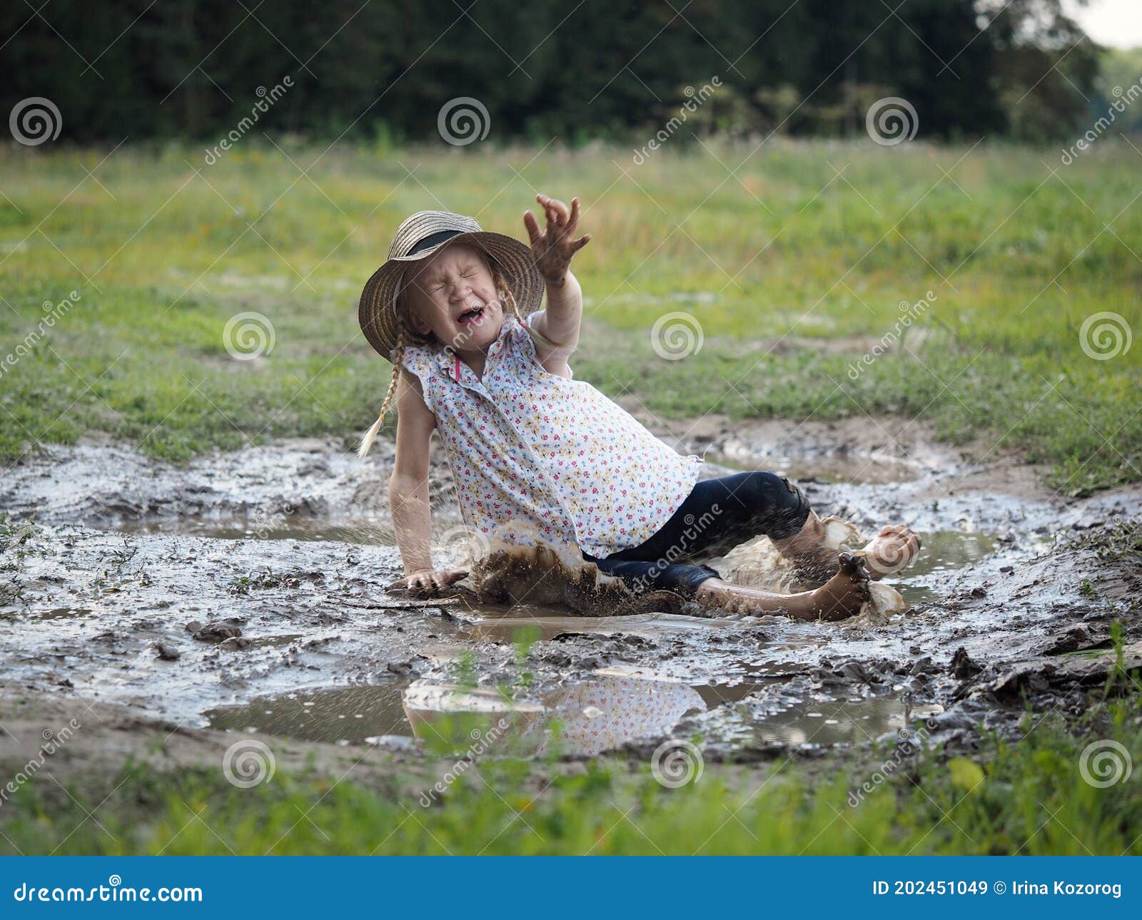 Child Falls in a Puddle. Field Stock Image - Image of dirty, barefoot ...