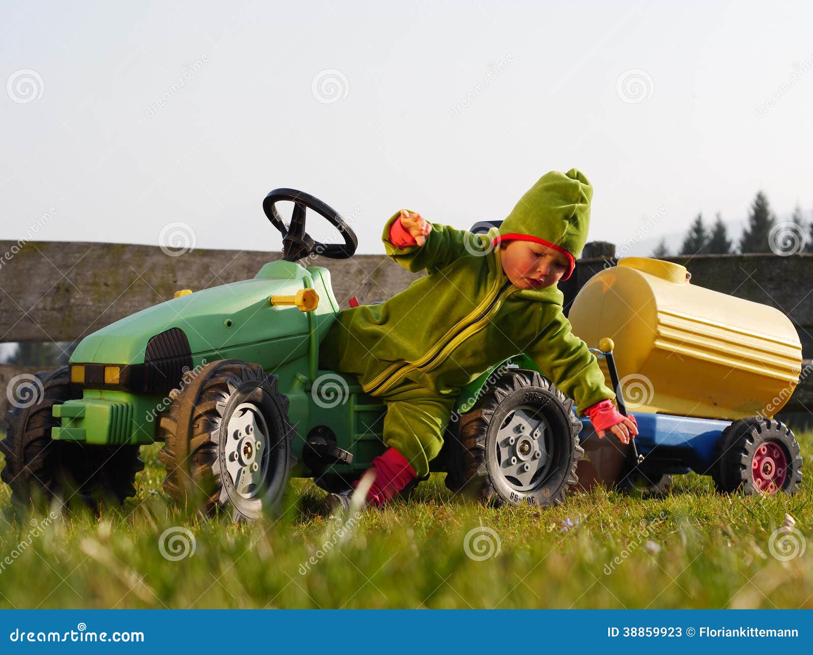 Red Child Tractor Side View Among Fresh Onion Shoots On The Field ...