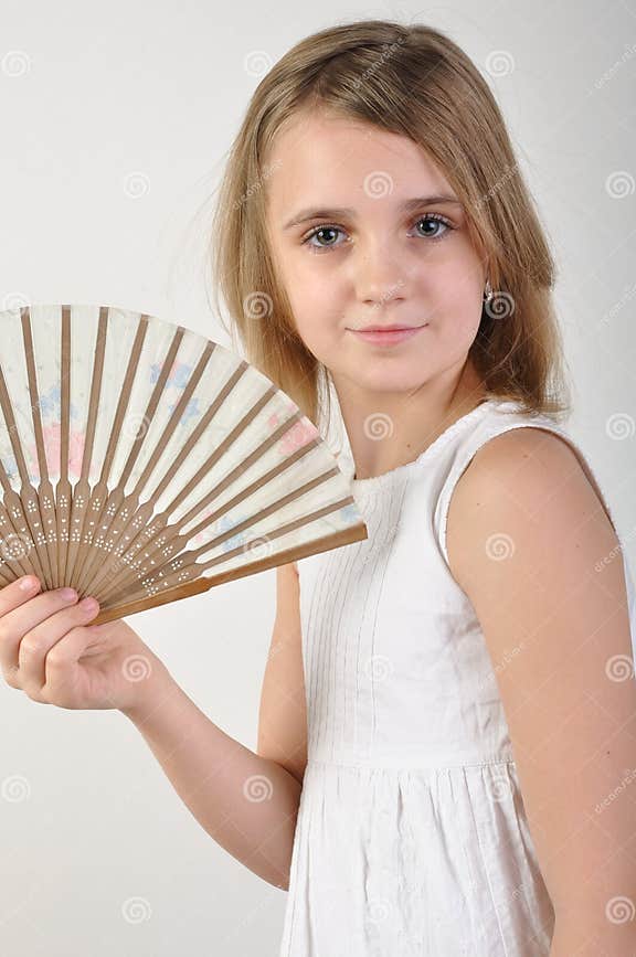 Child with a fan stock photo. Image of person, young - 22986796