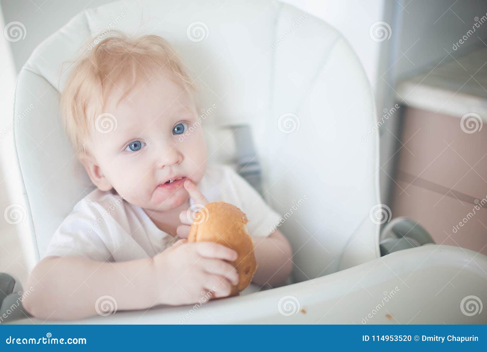 The child first eats bread stock photo. Image of child - 114953520