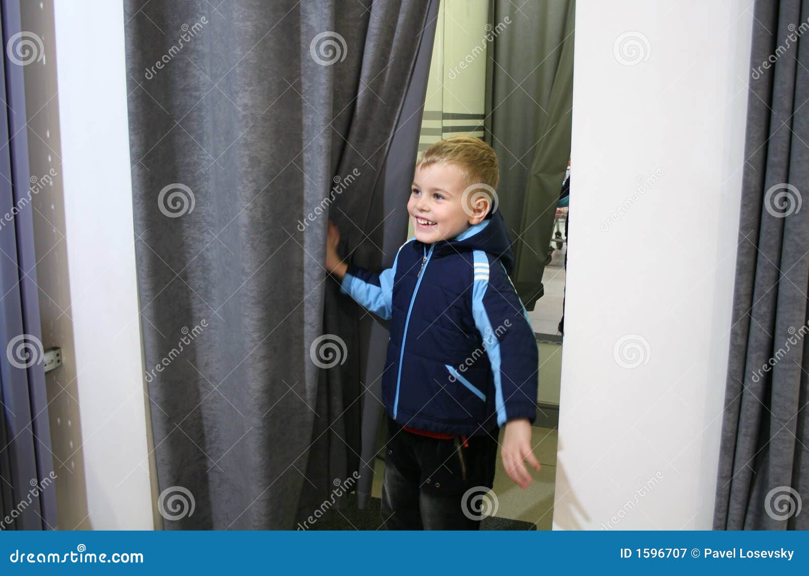 Child in fitting-room stock image. Image of coats, jupe - 1596707