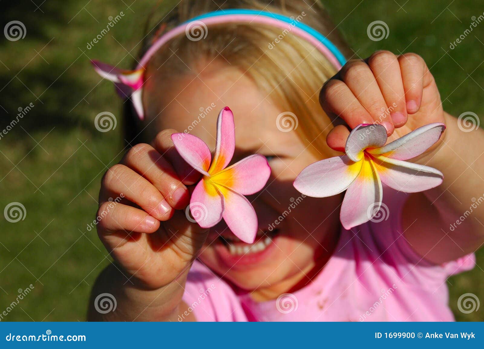 Child with flowers stock photo. Image of female, finger - 1699900