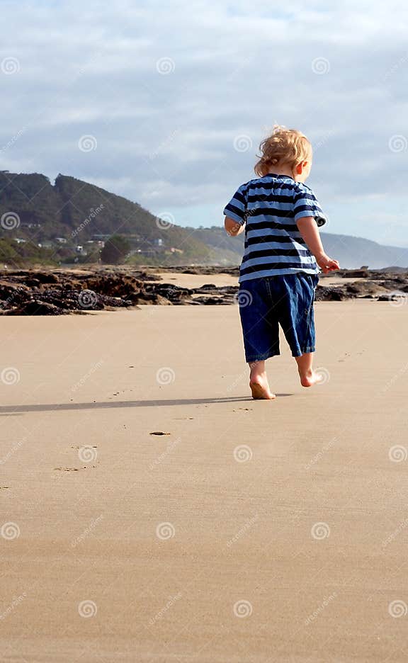 Child footsteps in sand stock image. Image of ocean, cloud - 2393363