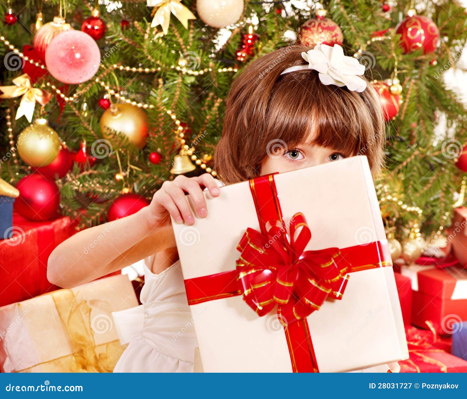 Child with Gift Box Near Christmas Tree. Stock Image - Image of ...
