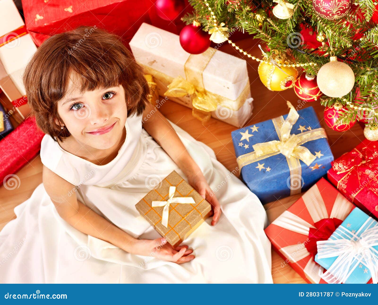 Child with Gift Box Near Christmas Tree. Stock Image - Image of ...