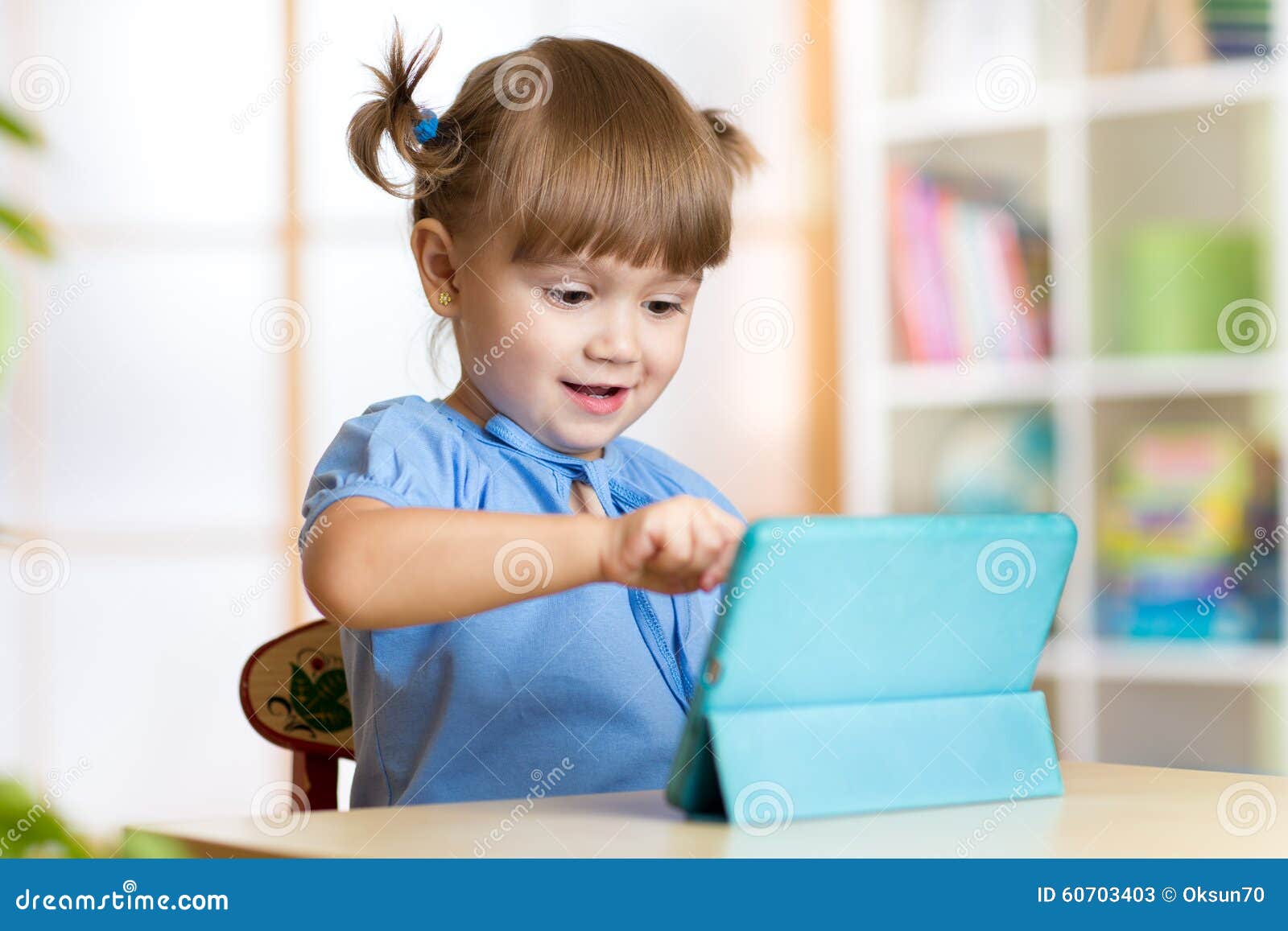 Child Girl Playing with a Digital Tablet at Home Stock Image - Image of ...