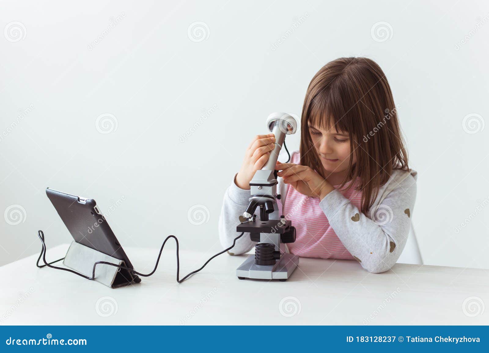 Child Girl in Science Class Using Digital Microscope. Technologies ...