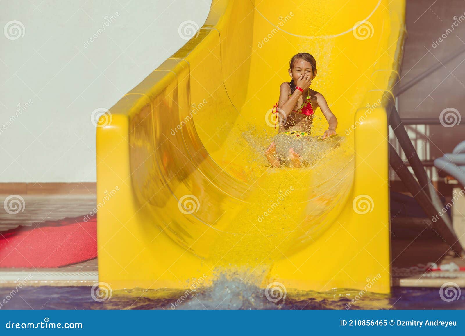 Child Sliding Down Water Slide in Pool Stock Image - Image of lifestyle ...