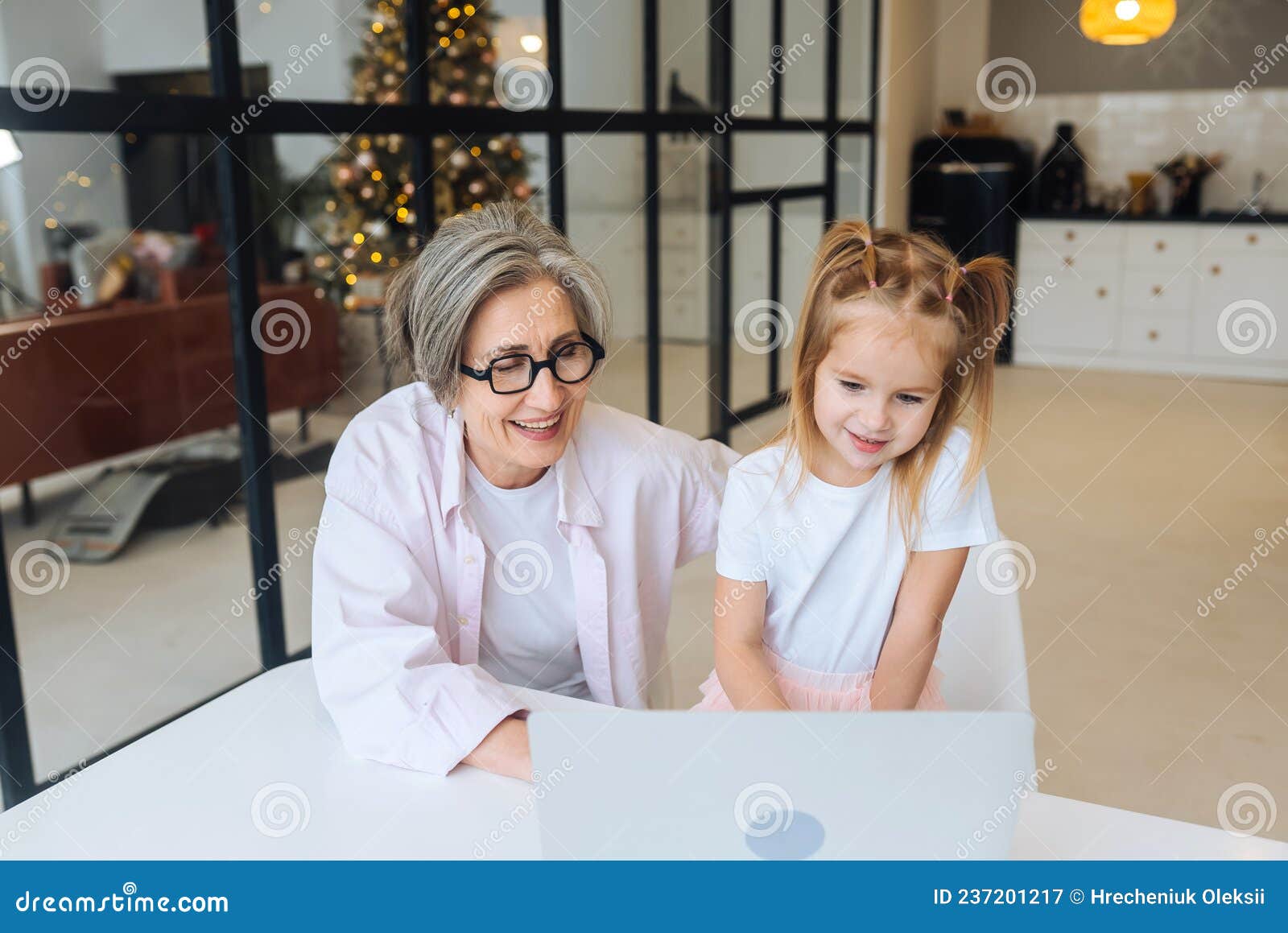 Child and Granny Looking at the Camera with Laptop Stock Image - Image ...