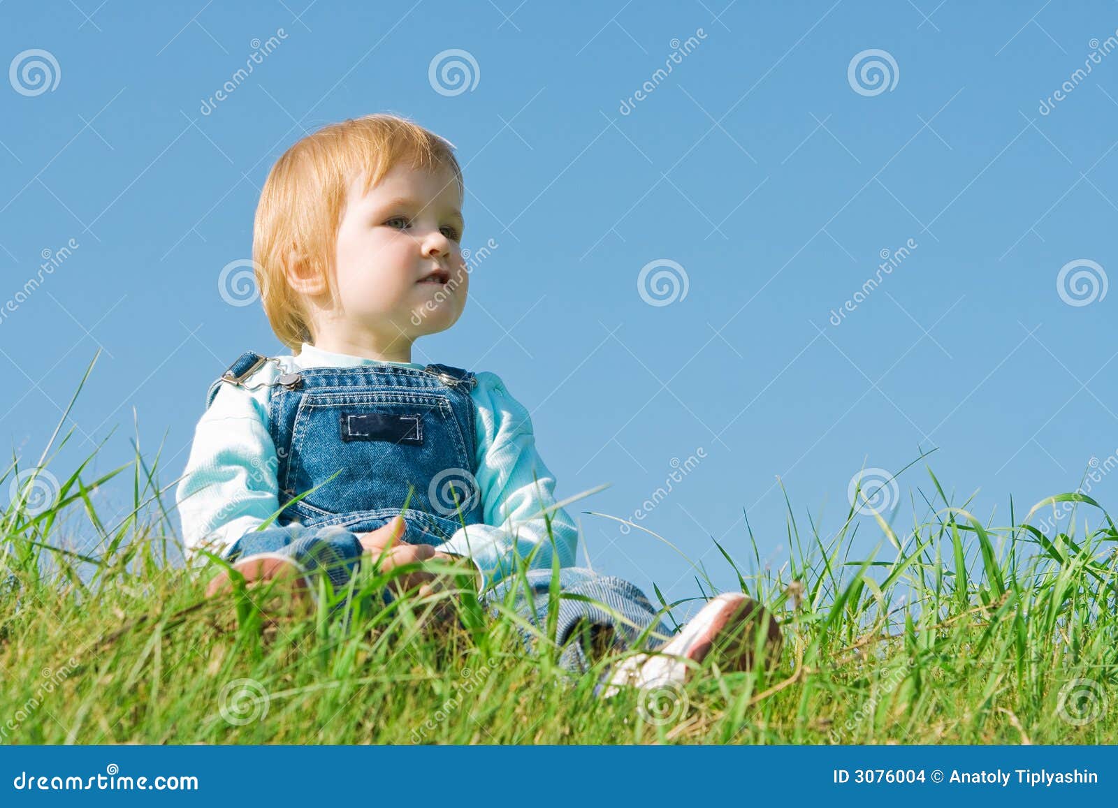 Child on green grass stock photo. Image of childhood, thinking - 3076004