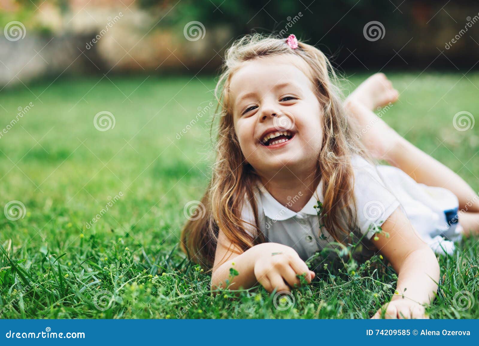 Child on green grass stock image. Image of green, adorable - 74209585