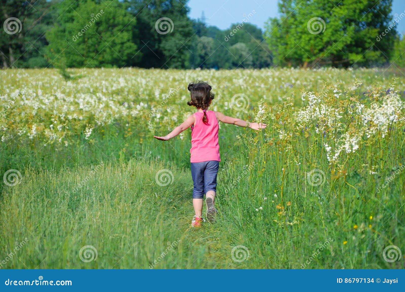 Child on Green Spring Meadow, Kid Running and Having Fun Stock Photo ...
