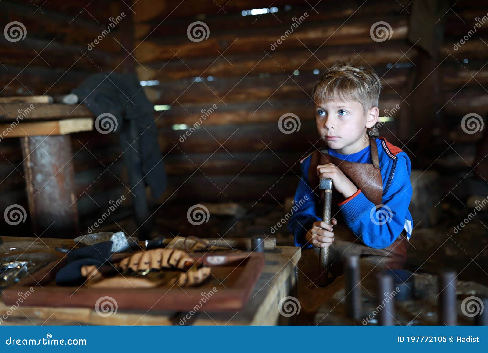 Child with hammer in forge stock image. Image of hand - 197772105