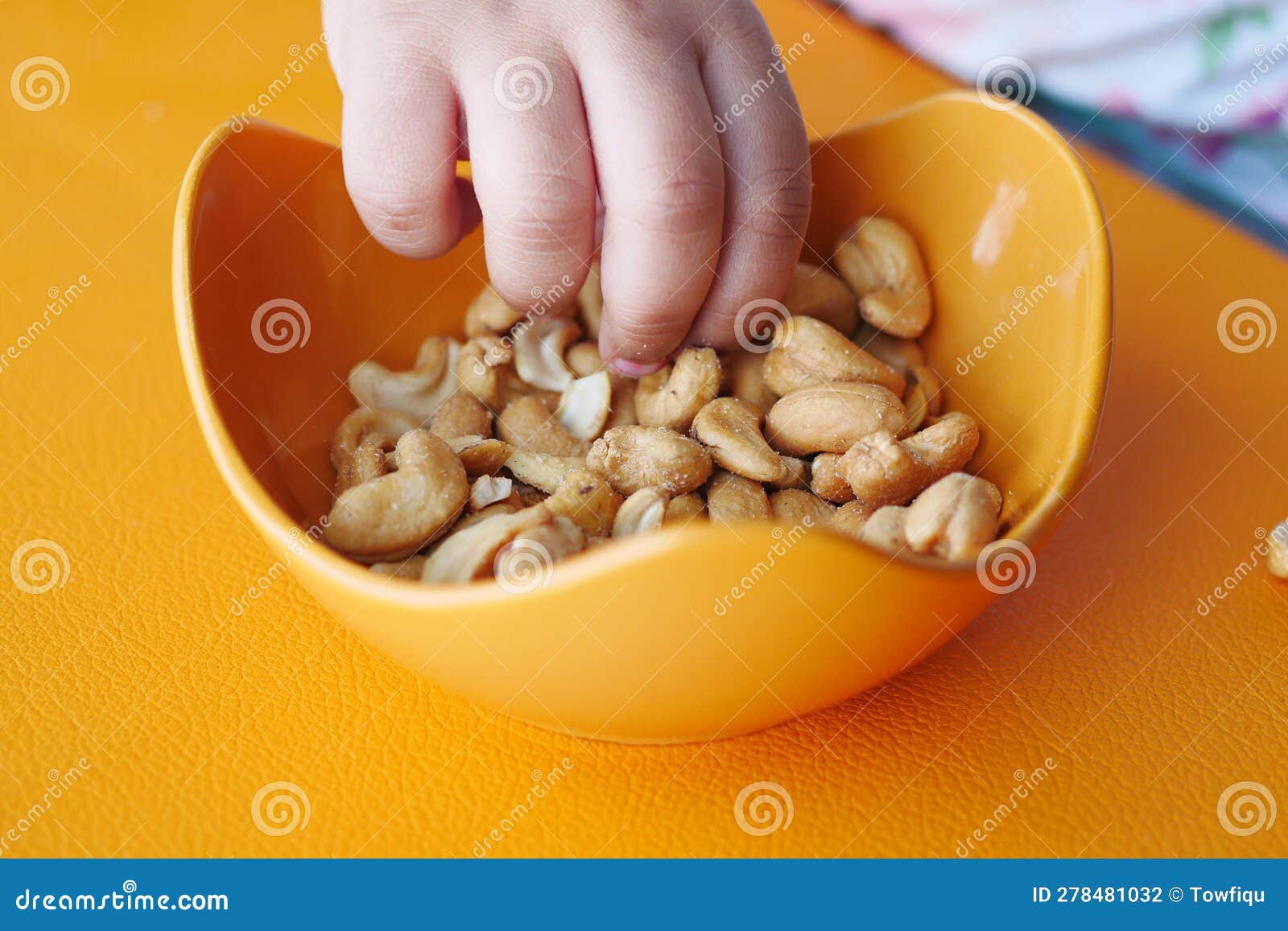 Child Hand Pick Peanuts in a Bowl on Table Stock Photo - Image of ...