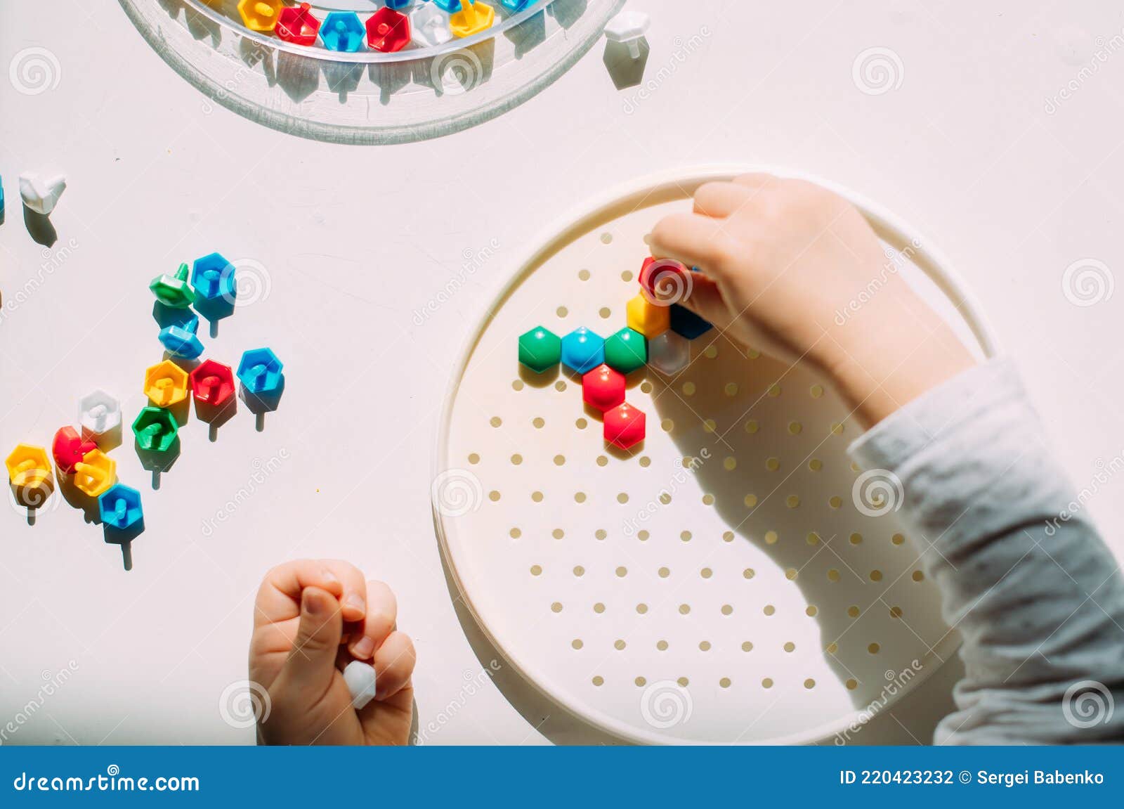 Child Hand Sticks the Mosaic into the Shape Stock Photo - Image of ...