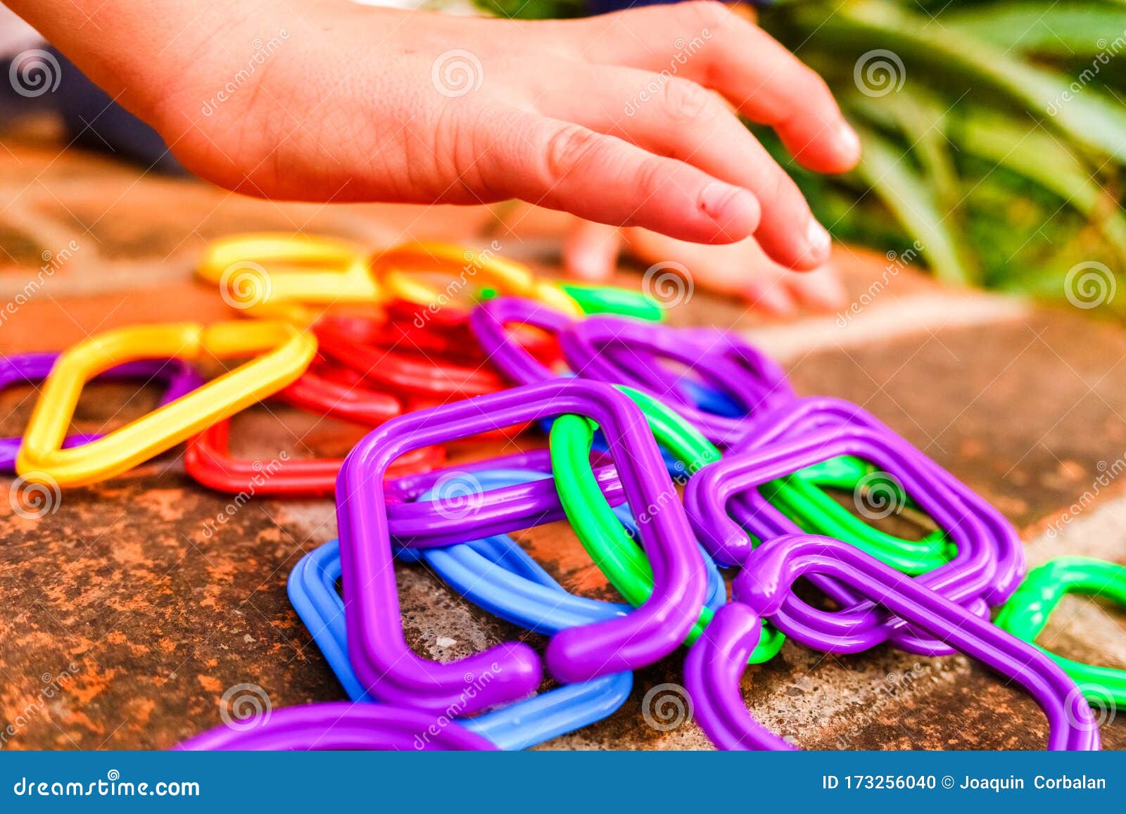 Child Hands Playing with Colored Plastic Pieces Stock Photo - Image of ...