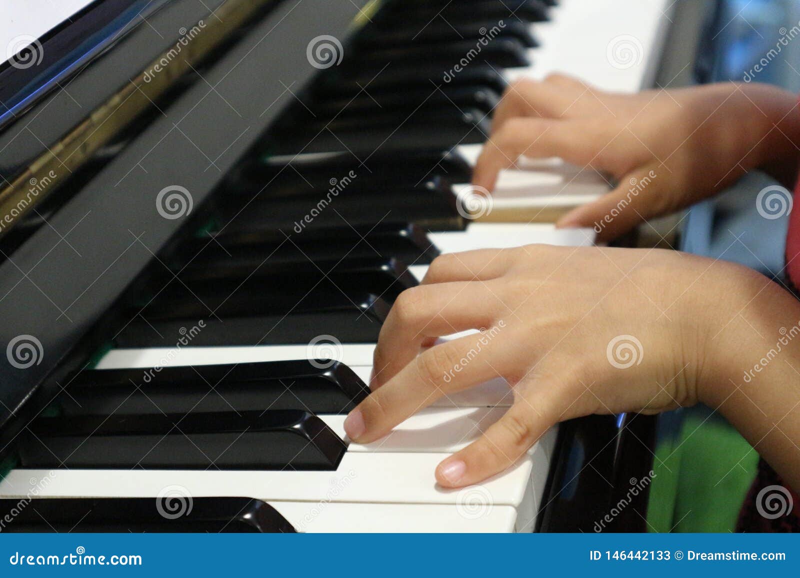 Child hands playing piano stock image. Image of home - 146442133