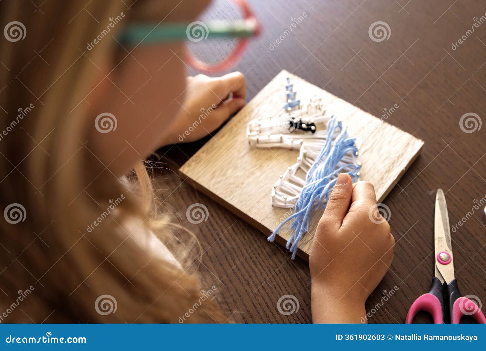 Child Hands Working on a String Art Project. Encouraging Creativity ...