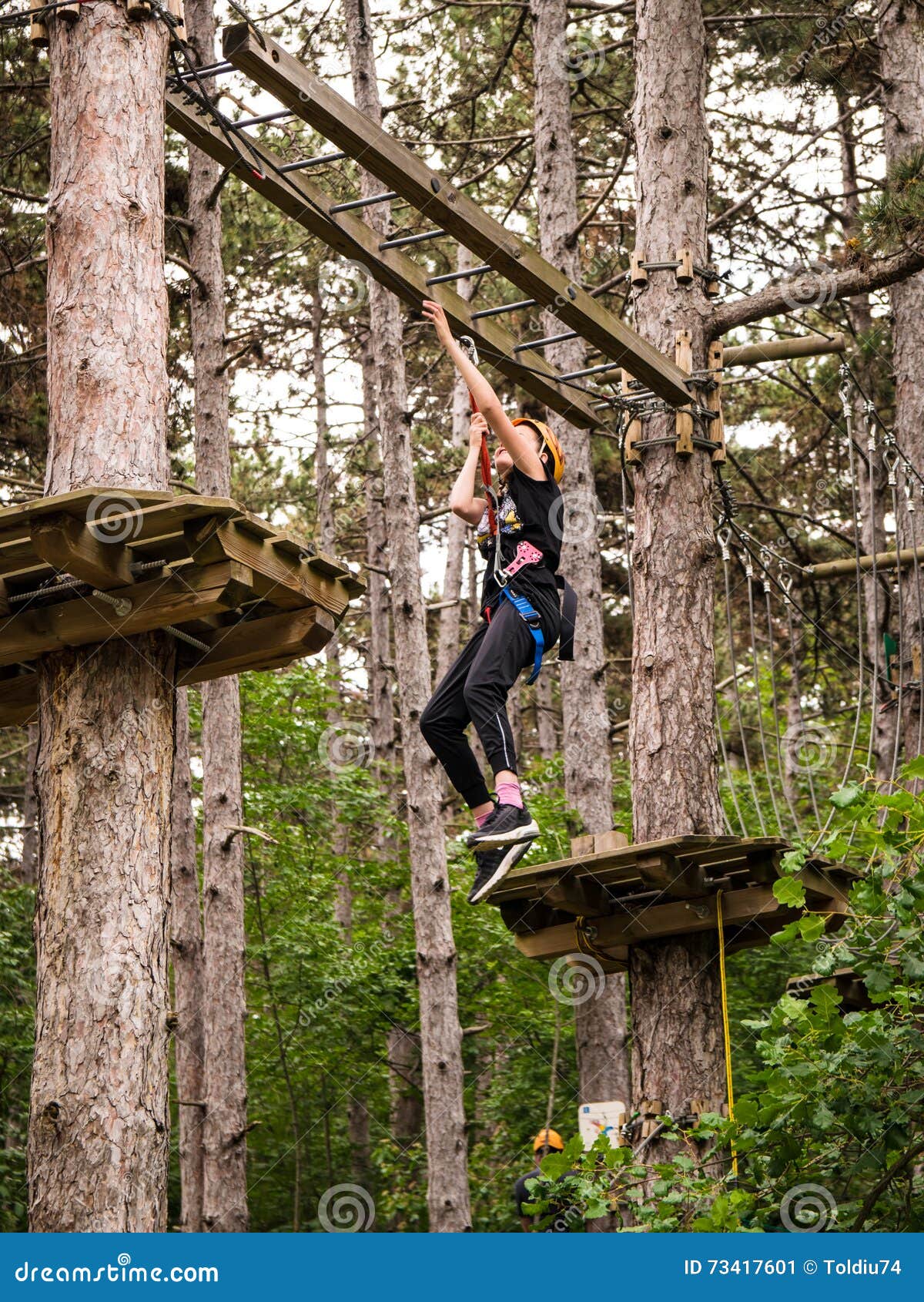 Child Hanging on a Safety Rope in an Adventure Trail. Editorial Photo ...