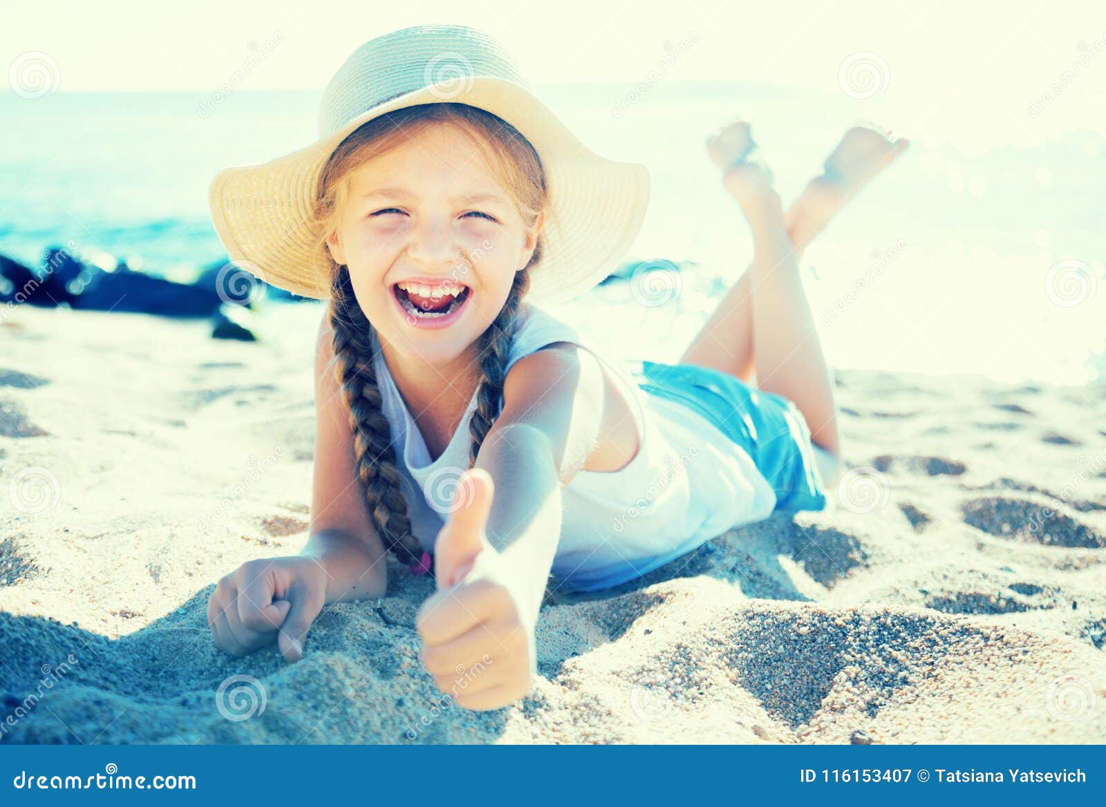 Child in Hat on Beach Shows Thumb Up Stock Image - Image of children ...